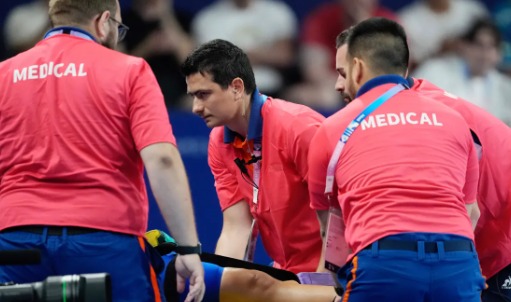 Olympic swimmer collapses after heat race, carried off on stretcher ...